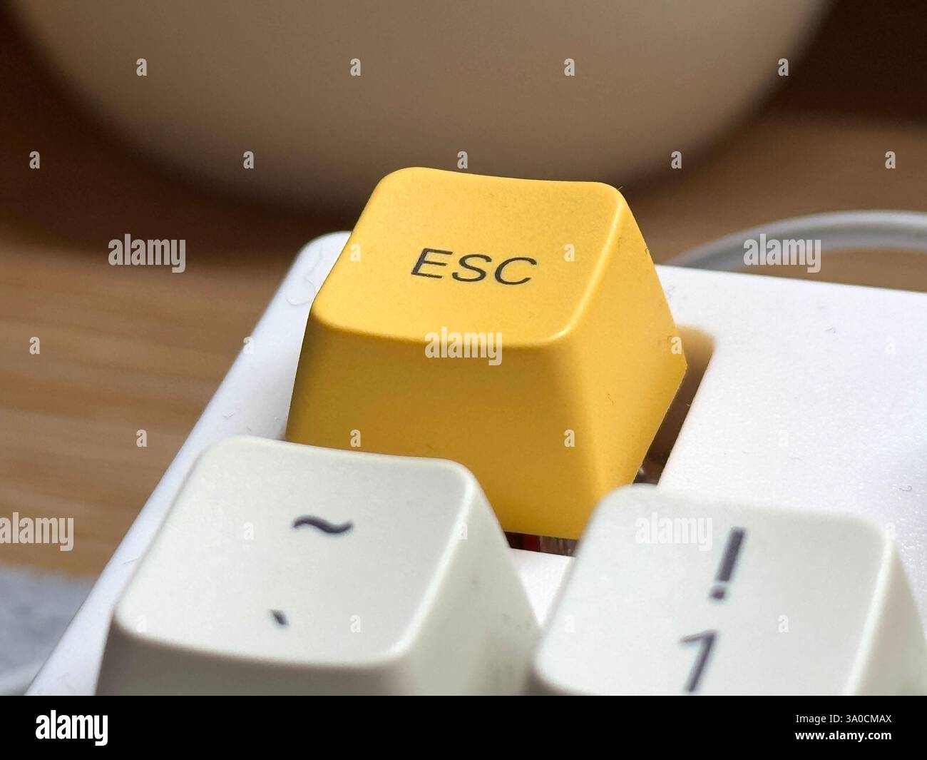 Yellow esc button at close range on mechanical keyboard for programmer Stock Photo - Alamy