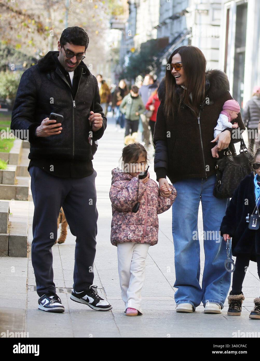 Giorgia Palmas and Filippo Magnini walking downtown with their daughter ...