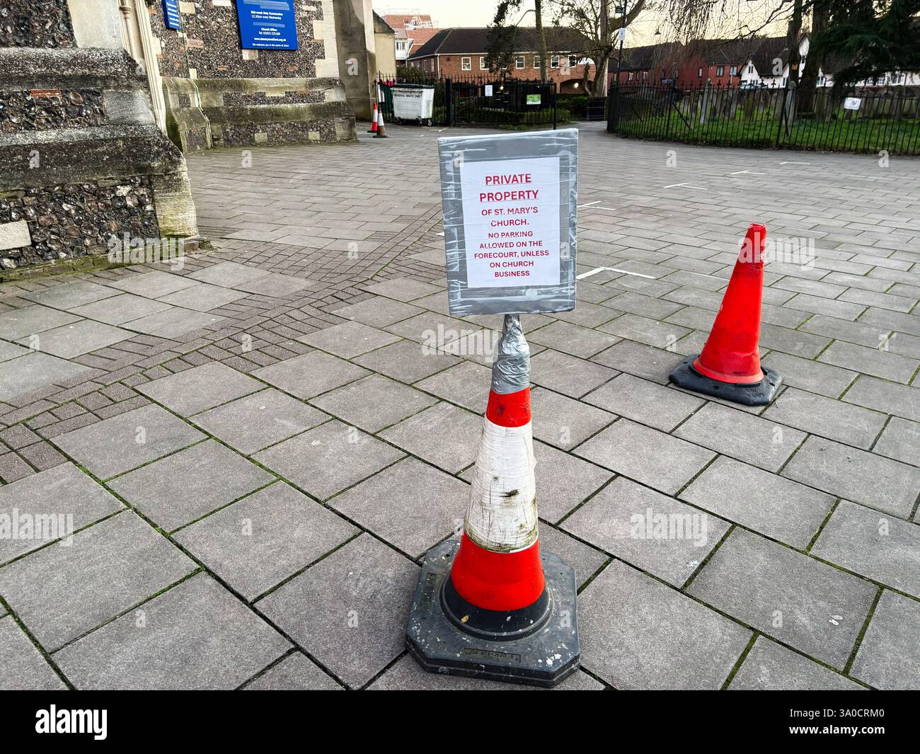 London, UK - March 02, 2025: A warning sign on a church pavement with ...