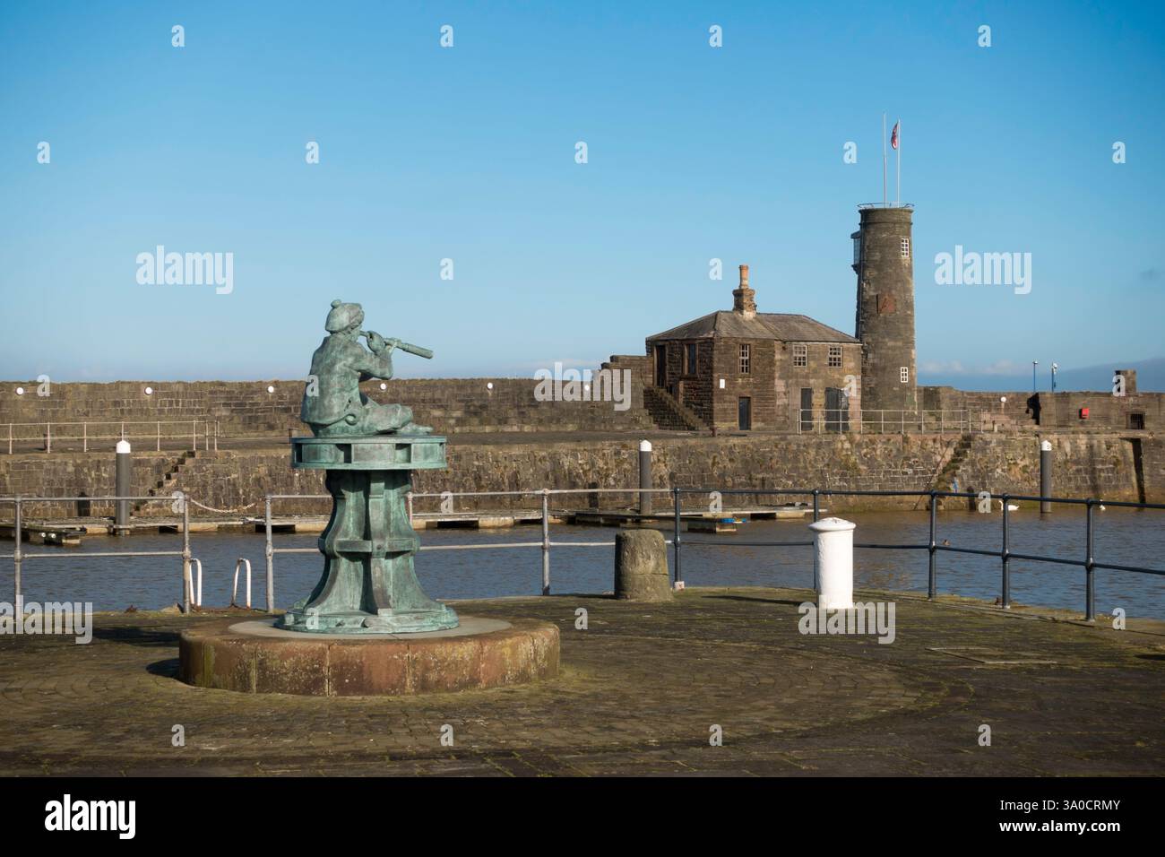 The Boy with Telescope sculpture with the Watch House and lighthouse on ...