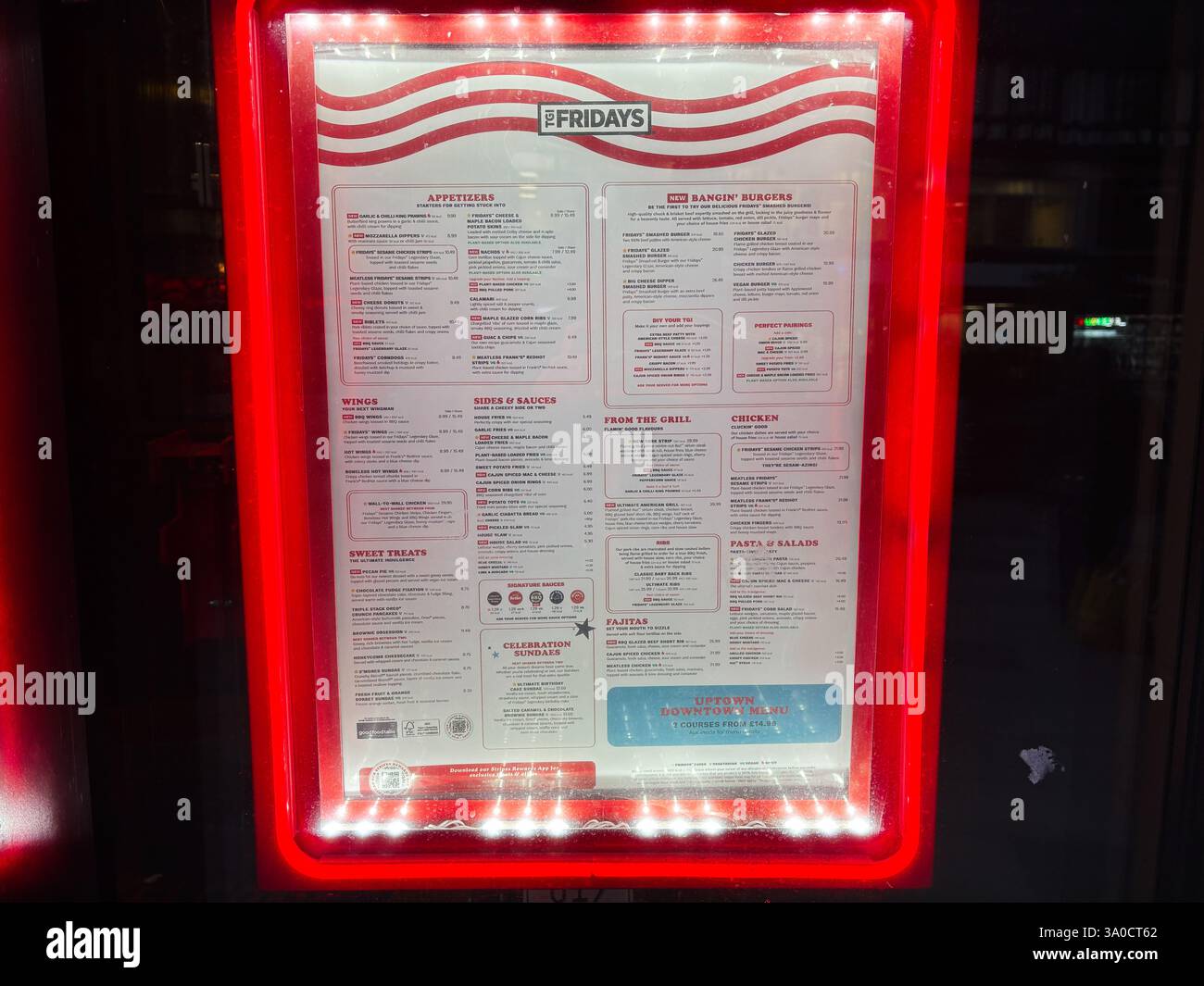 London, UK - March 02, 2025: A visually distinctive illuminated TGI ...