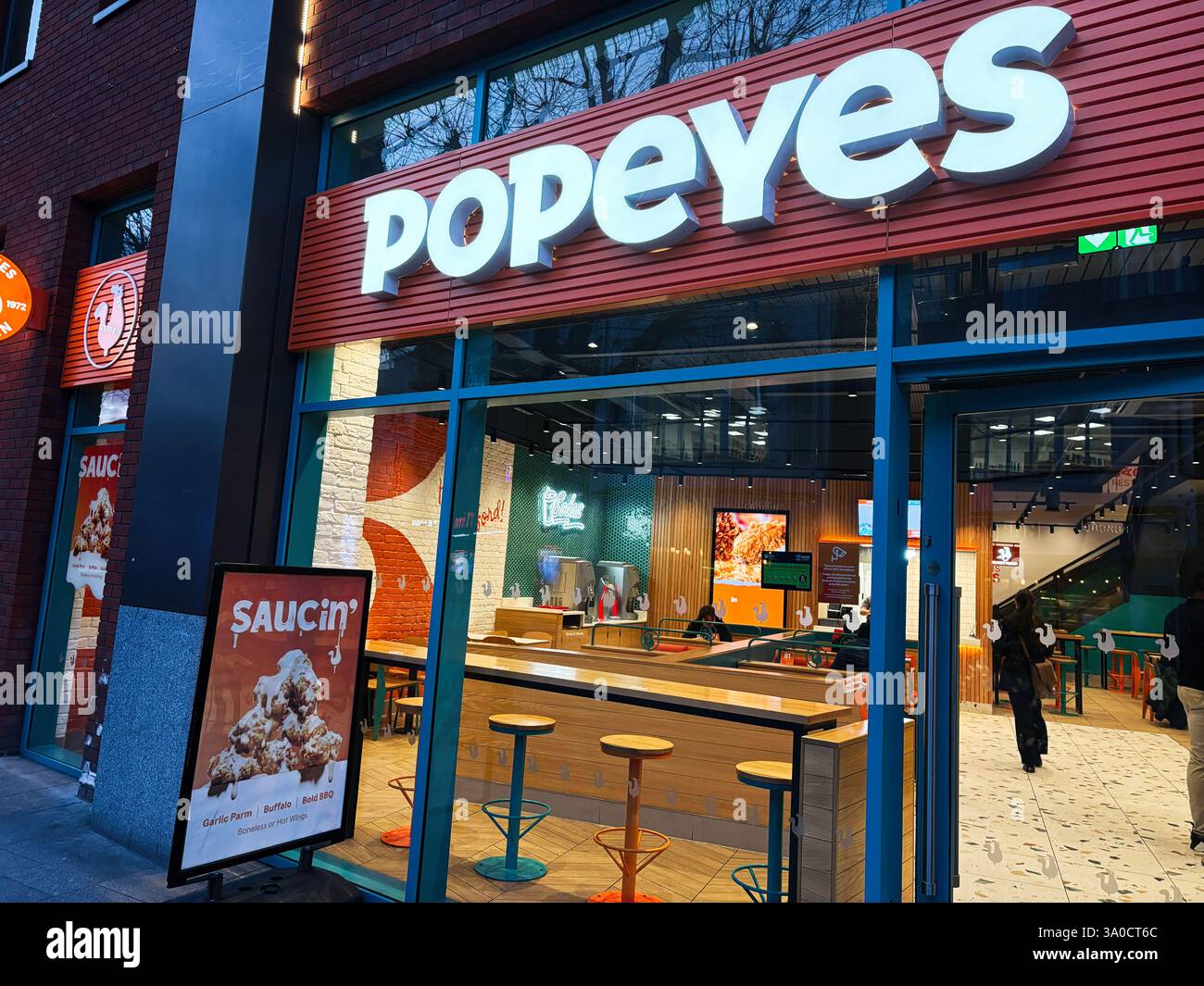 London, UK - March 02, 2025: Fast food Popeyes restaurant facade with ...
