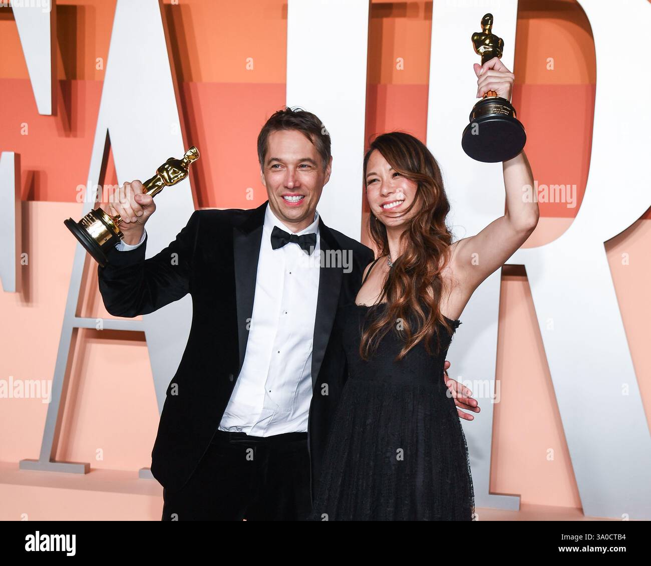 USA. 03rd Mar, 2025. Sean Baker and Samantha Quan walking on the red ...