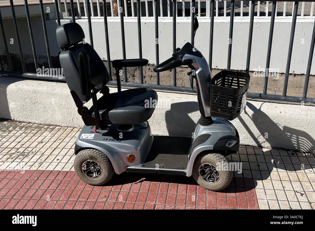 A grey Mobility Scooter parked on the Costa Adeje Seafront. Tenerife ...