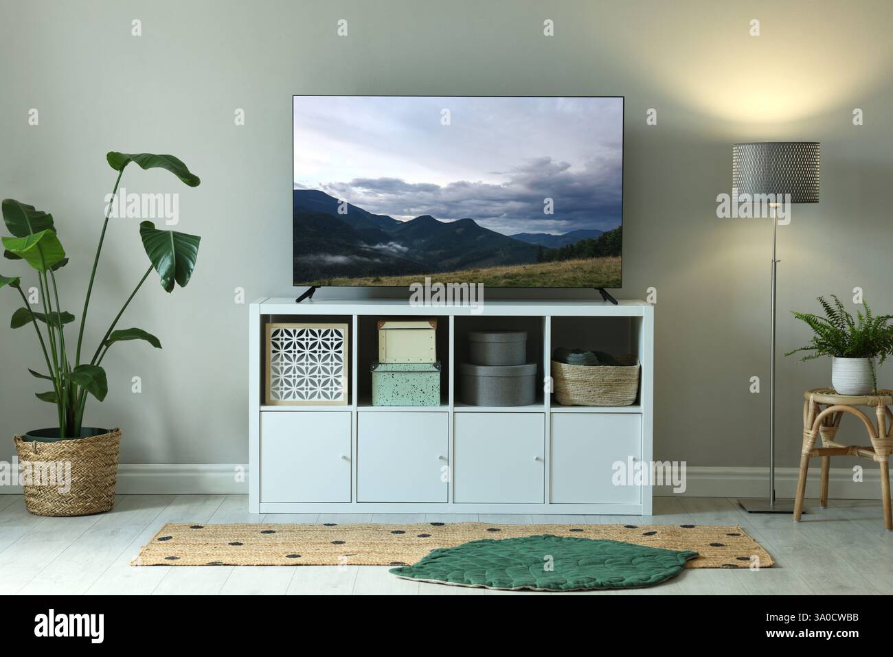 TV set with nature landscape on screen in room Stock Photo - Alamy