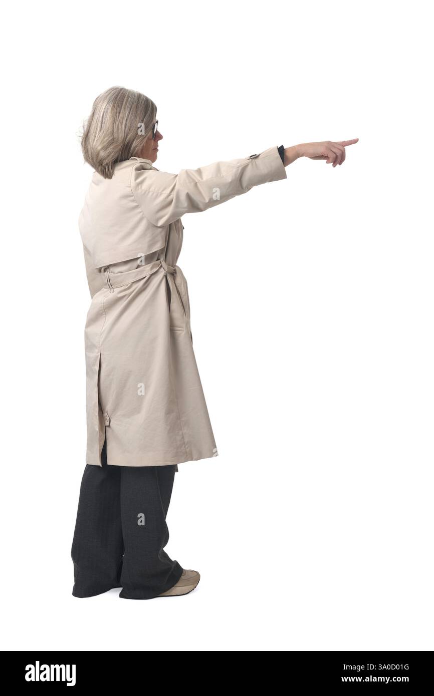 side view of an adult woman standing and pointing front on white ...