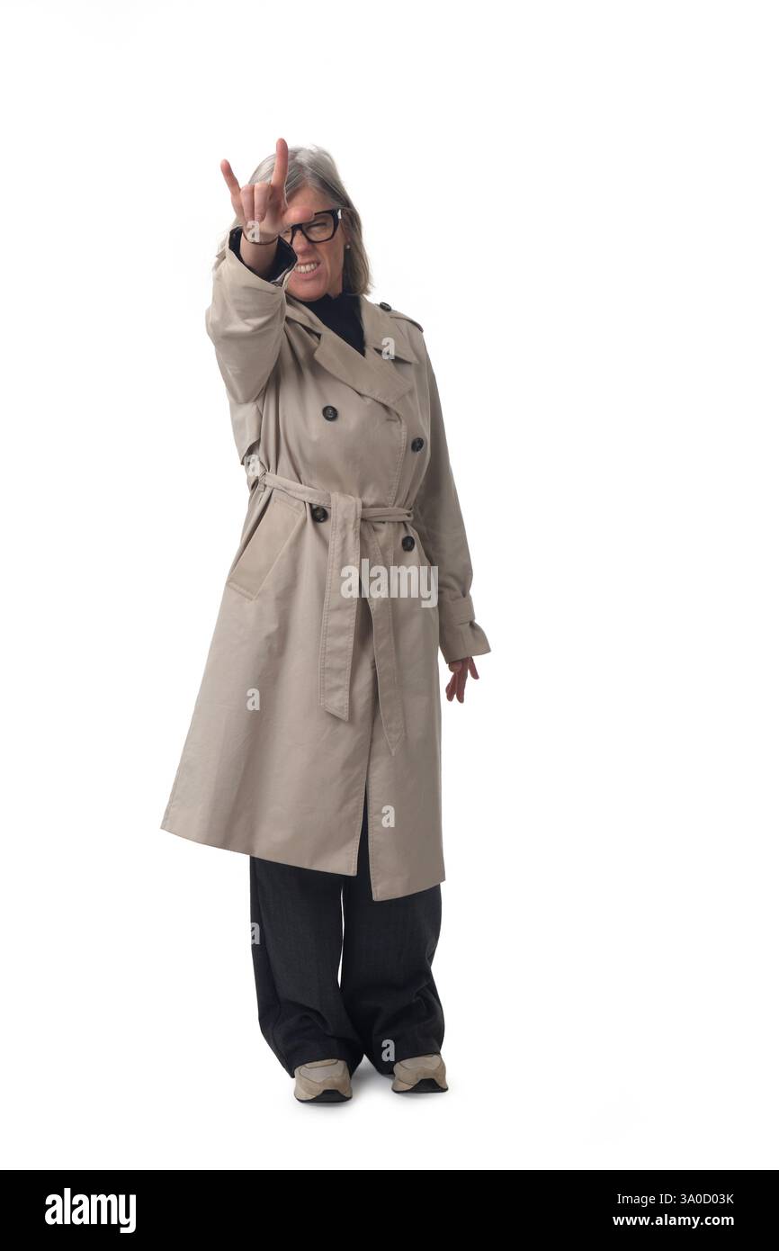 front view of a woman showing the horns sign with fingers on white ...
