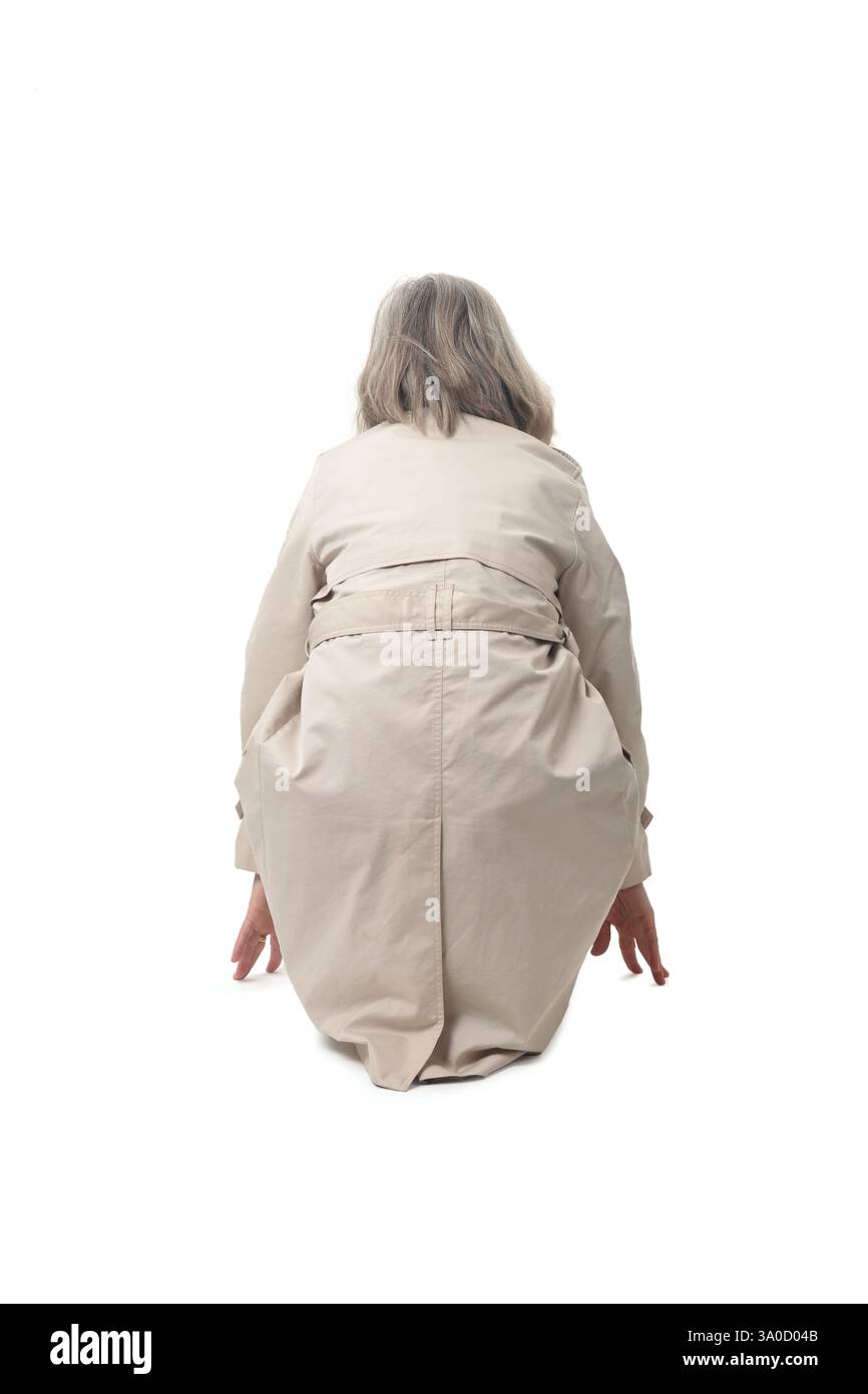 back view o f a woman squatting on white background Stock Photo - Alamy