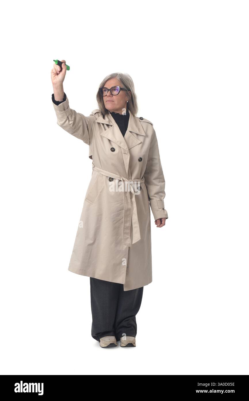 front view of a woman drawing with marker with raised arm on white ...