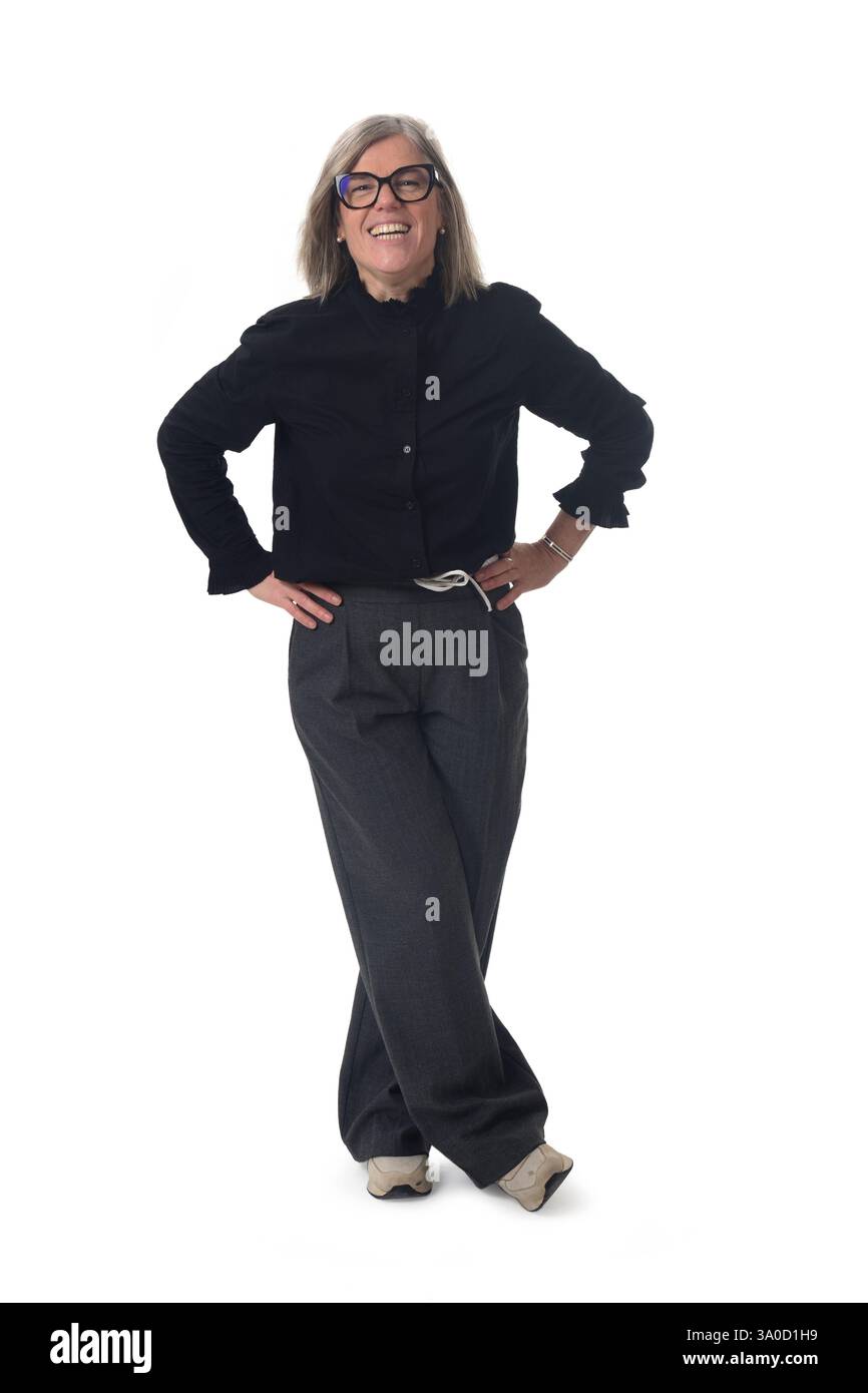 front view of a woman dressed in dark clothing with legs crossedand ...