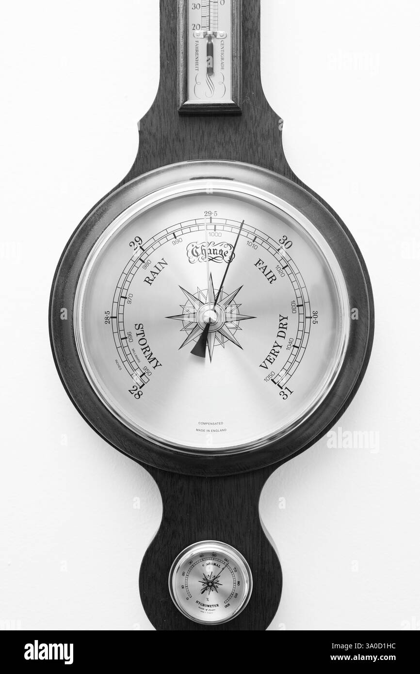 Close up of an aneroid barometer mounted on a wall Stock Photo - Alamy