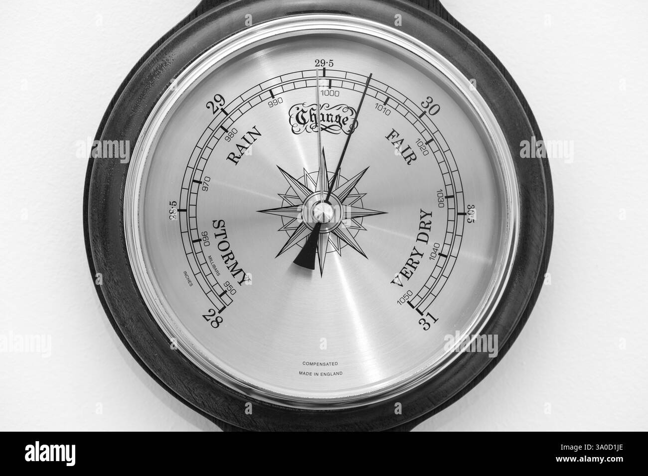 Close up of an aneroid barometer mounted on a wall Stock Photo - Alamy