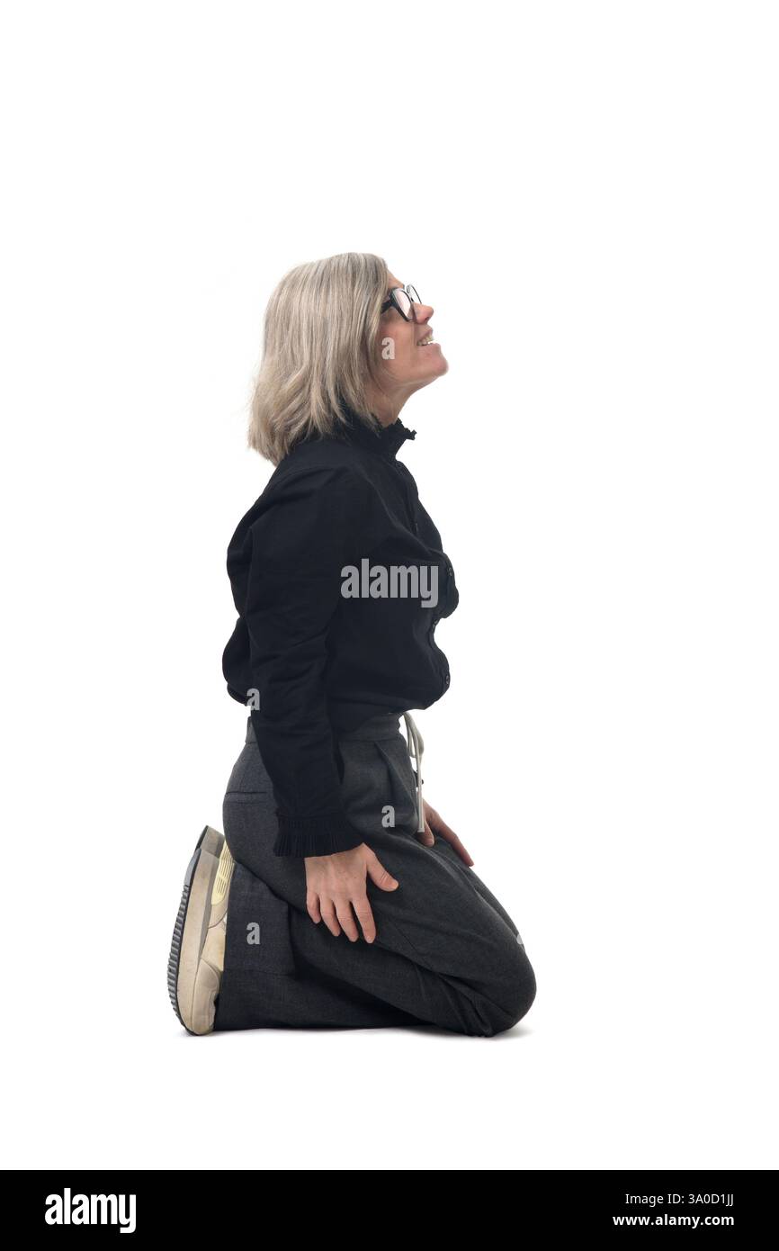 profile woman kneeling looking up on white background Stock Photo - Alamy
