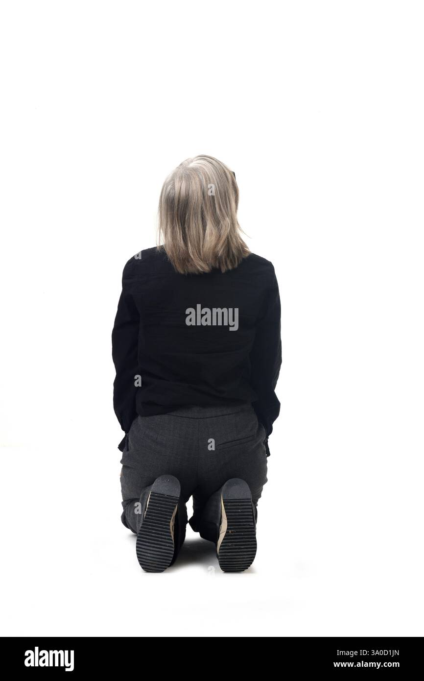 back view of a woman kneeling looking up on white background Stock ...