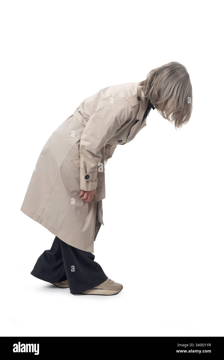 full portrait of side view of a woman crouched down and looking the ...