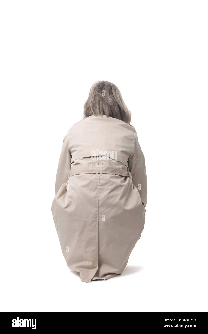 back view of a woman squatting on white background Stock Photo - Alamy