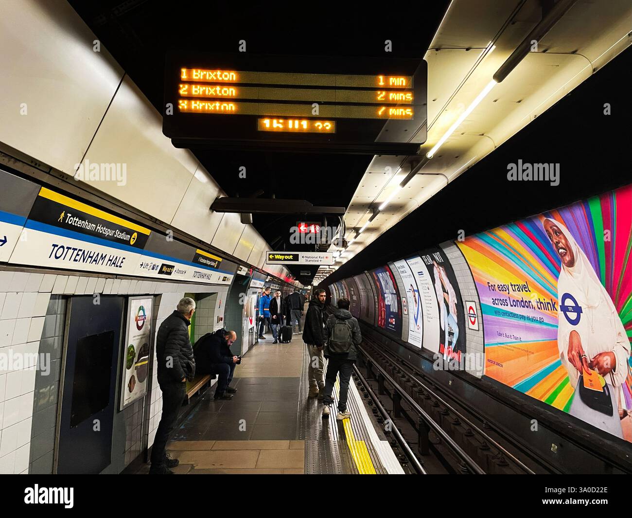 London, UK - March 02, 2025: Passengers waiting at a London underground ...