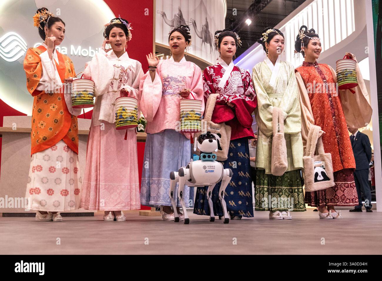 Barcelona, Spain. 3 March, 2025: Hostesses in traditional dresses are ...