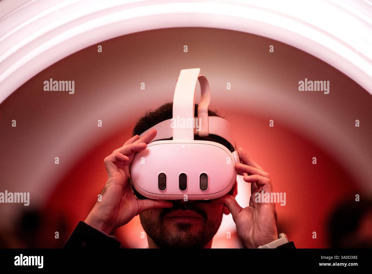 Barcelona, Spain. 3rd Mar, 2025. A visitor experiences virtual reality at the Vodafone booth ...