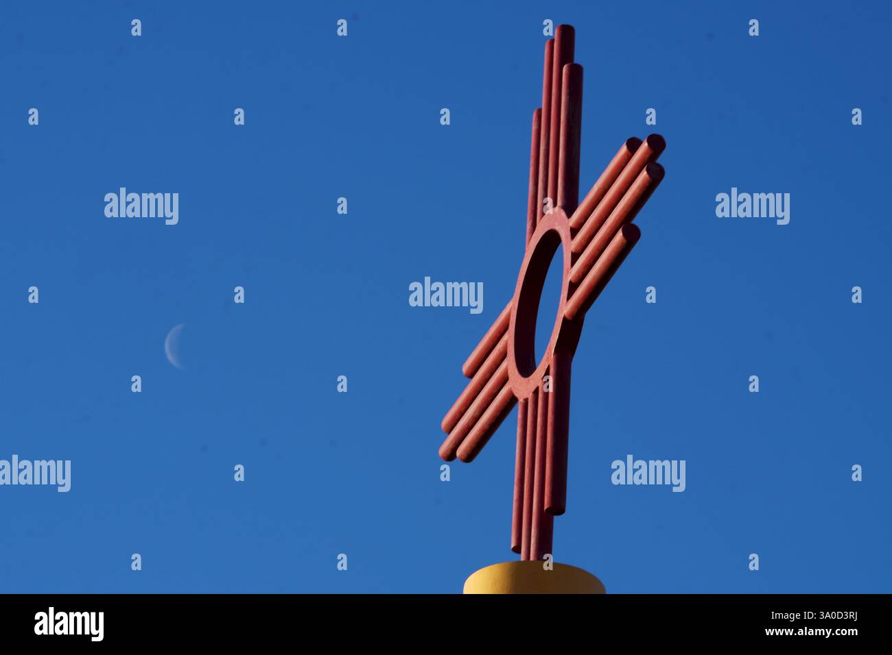 The moon is seen near a sign welcoming travelers into Hobbs, N.M ...