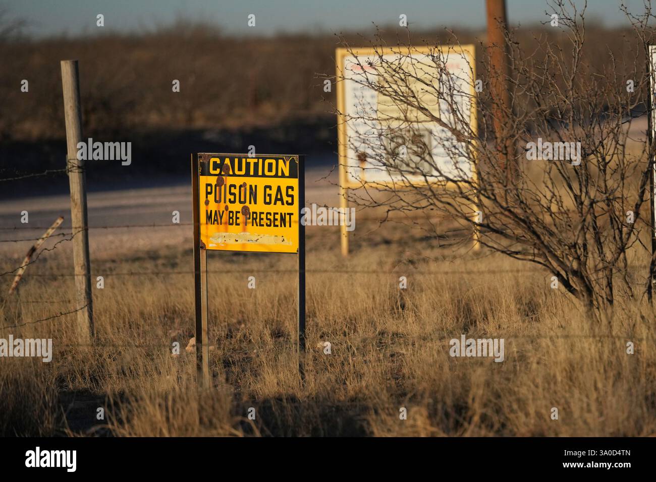 A caution sign displays information on poison gas present is seen on an ...