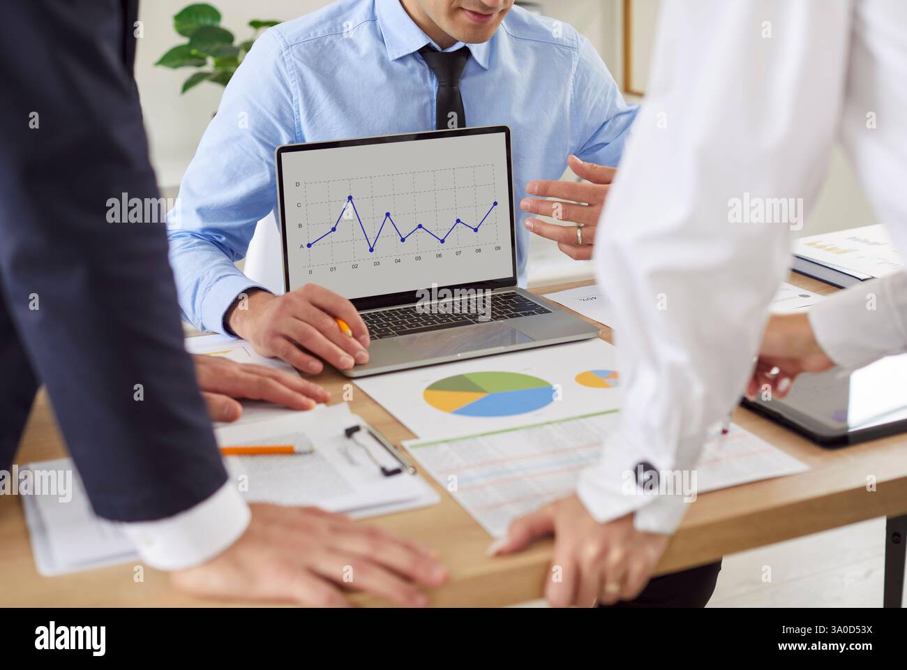 Team working at desk, laptop close up, group using presentation with ...