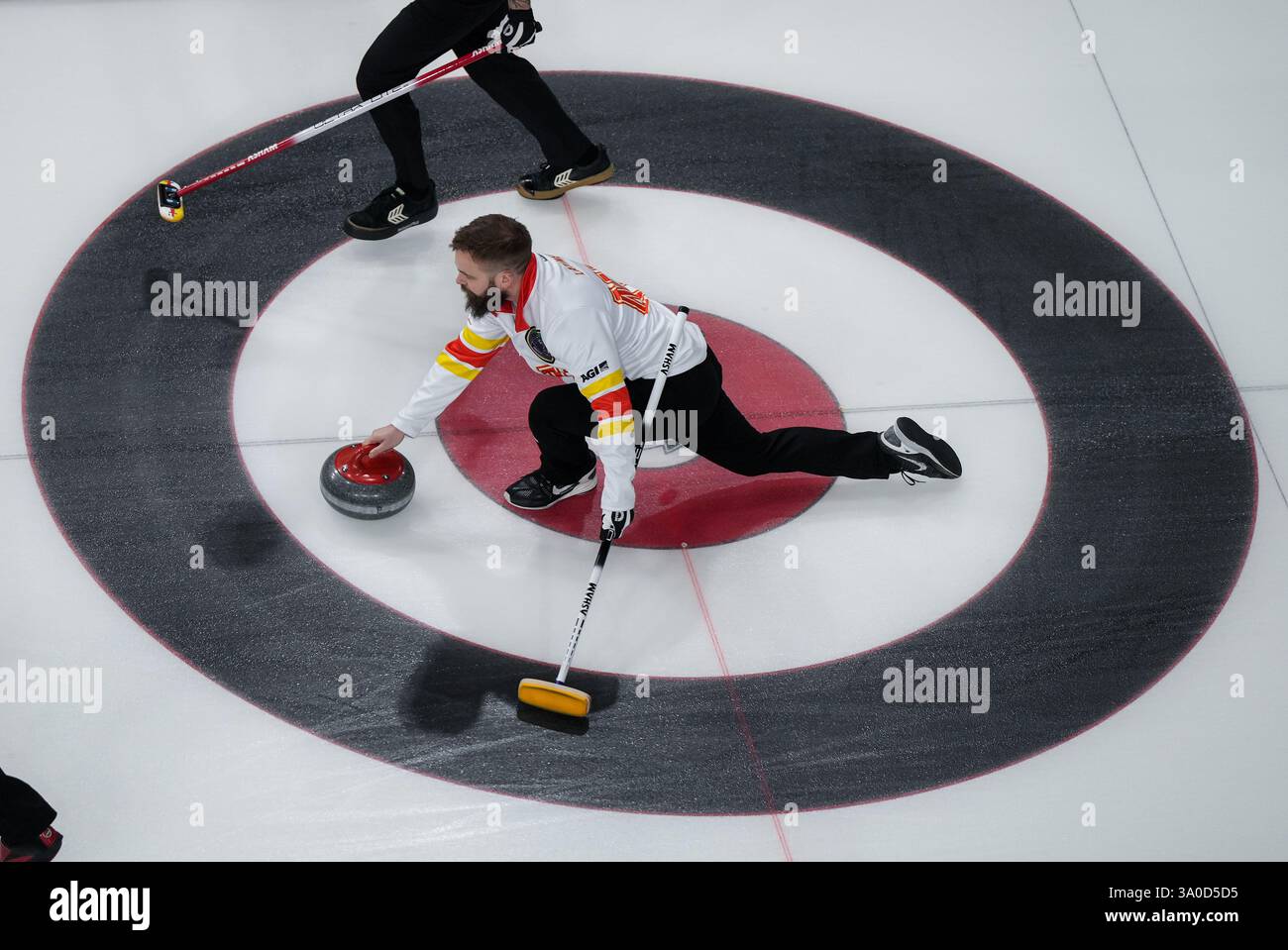 Kelowna, Canada. 03rd Mar, 2025. Nunavut skip Shane Latimer delivers a rock while playing ...