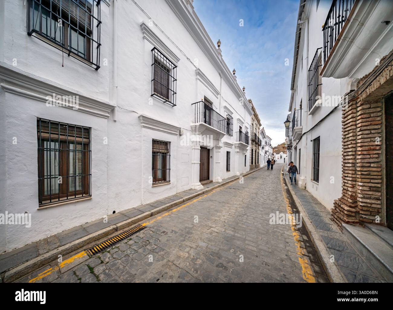 Llerena, Spain, Nov 30 2024, Visitors stroll along the cobblestone ...