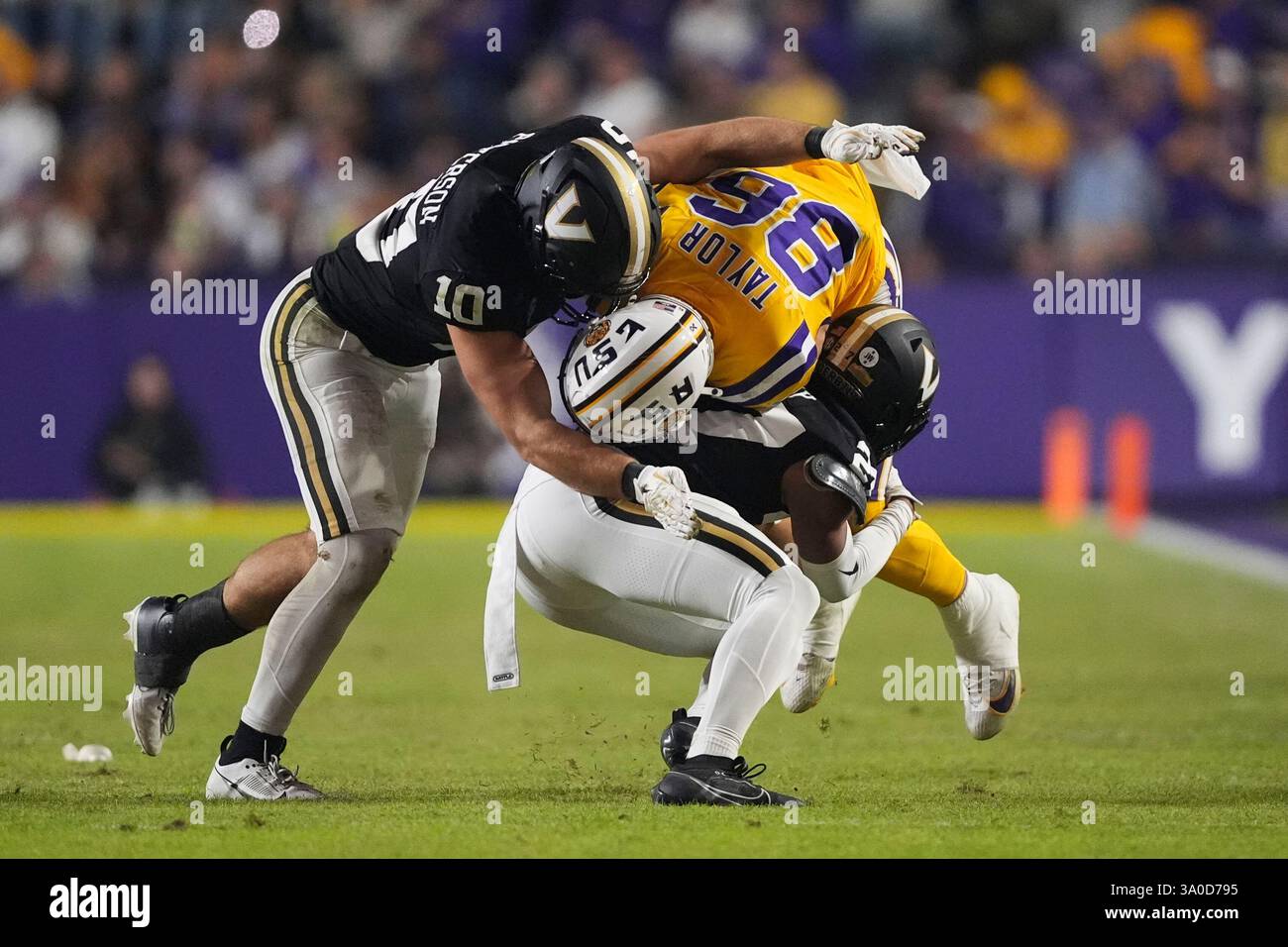 FILE - LSU tight end Mason Taylor (86) is tackled by Vanderbilt ...