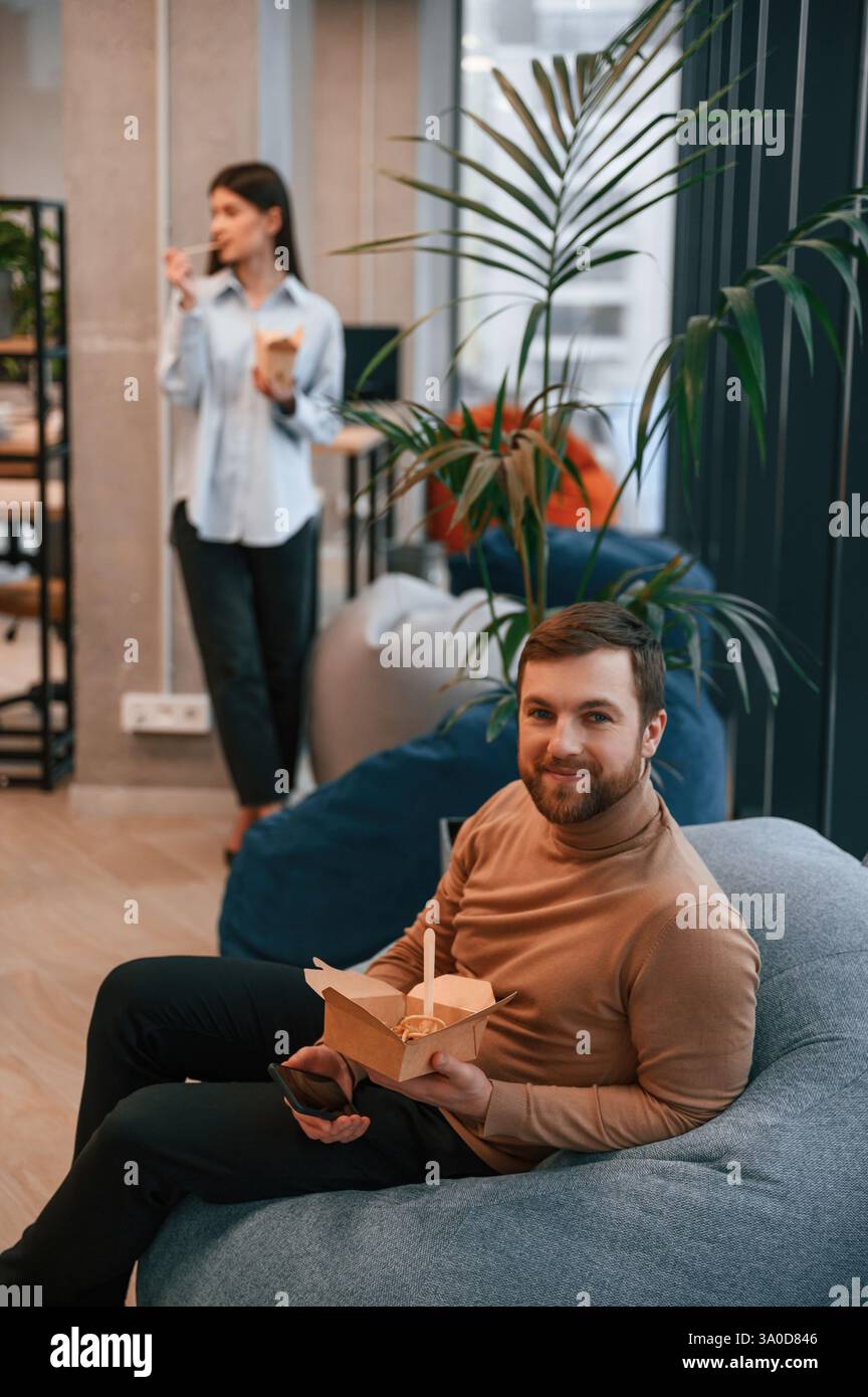 Office workers are in the rest zone is having a break and eating food ...