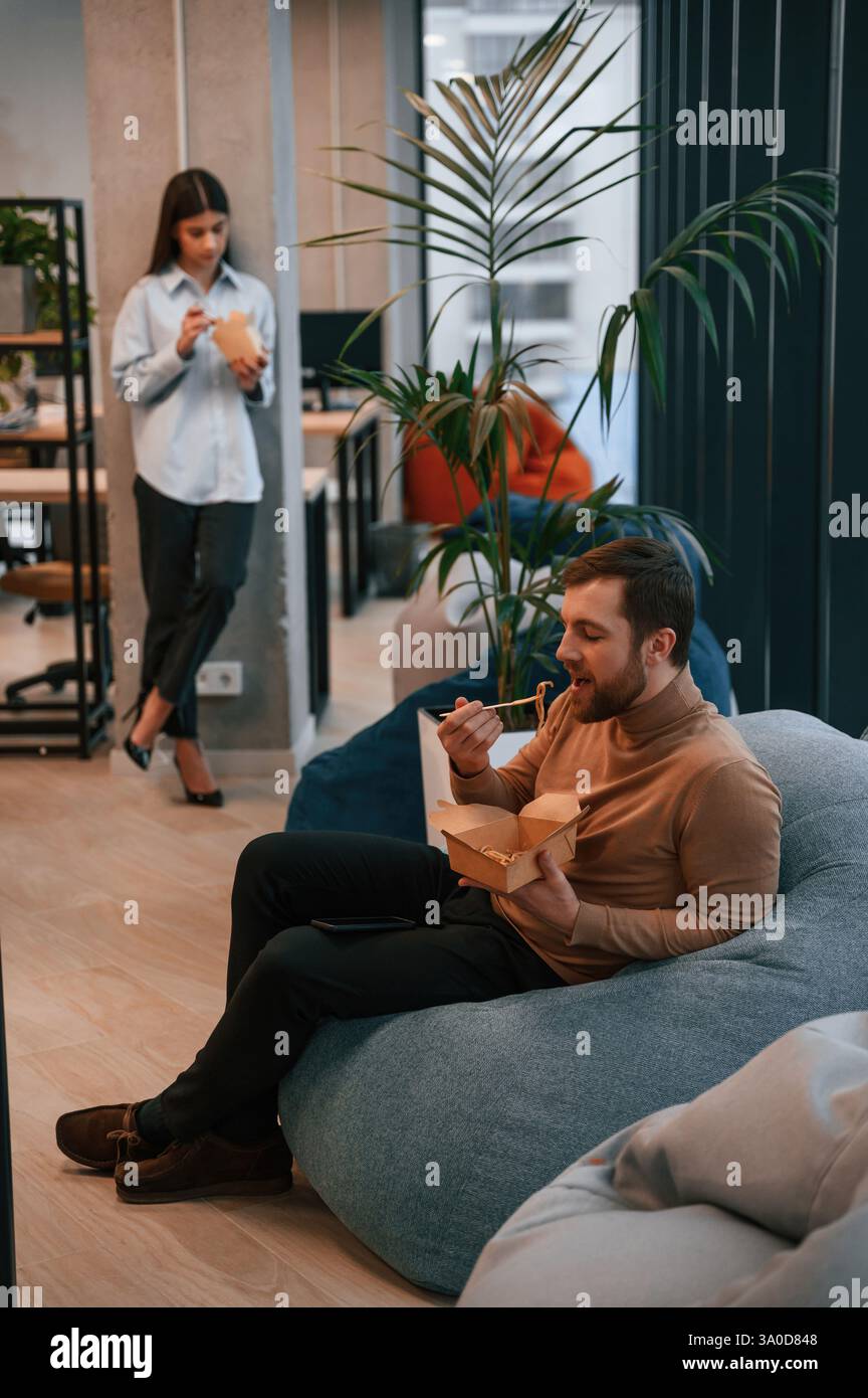 Office workers are in the rest zone is having a break and eating food ...