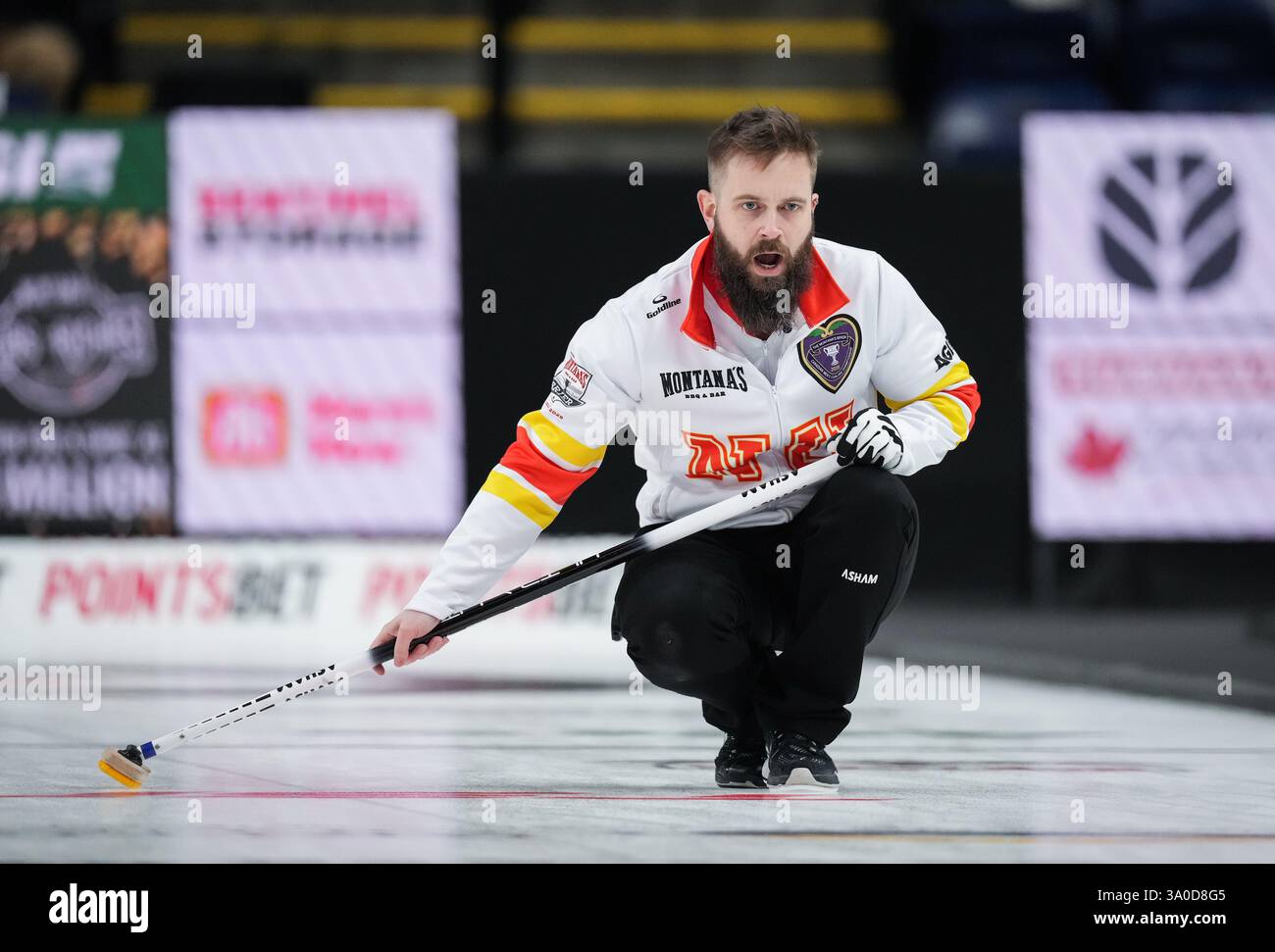 Kelowna, Canada. 03rd Mar, 2025. Nunavut skip Shane Latimer calls out to the sweepers while ...