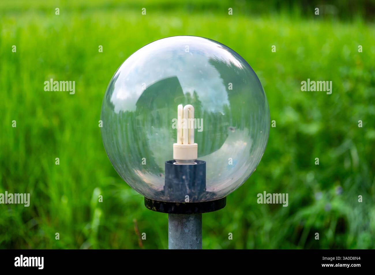 Outdoor light with large glass spheres housing fluorescent bulbs ...