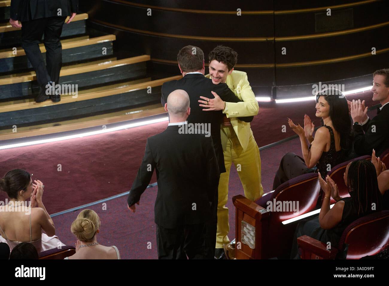 Ron Bartlett hugs Timothee Chalamet during the live ABC Telecast of the 97th Oscars® at the ...