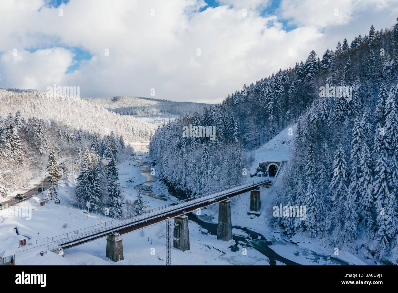 Aerial view of Carpathian mountains. Bridge, river and road with cars ...