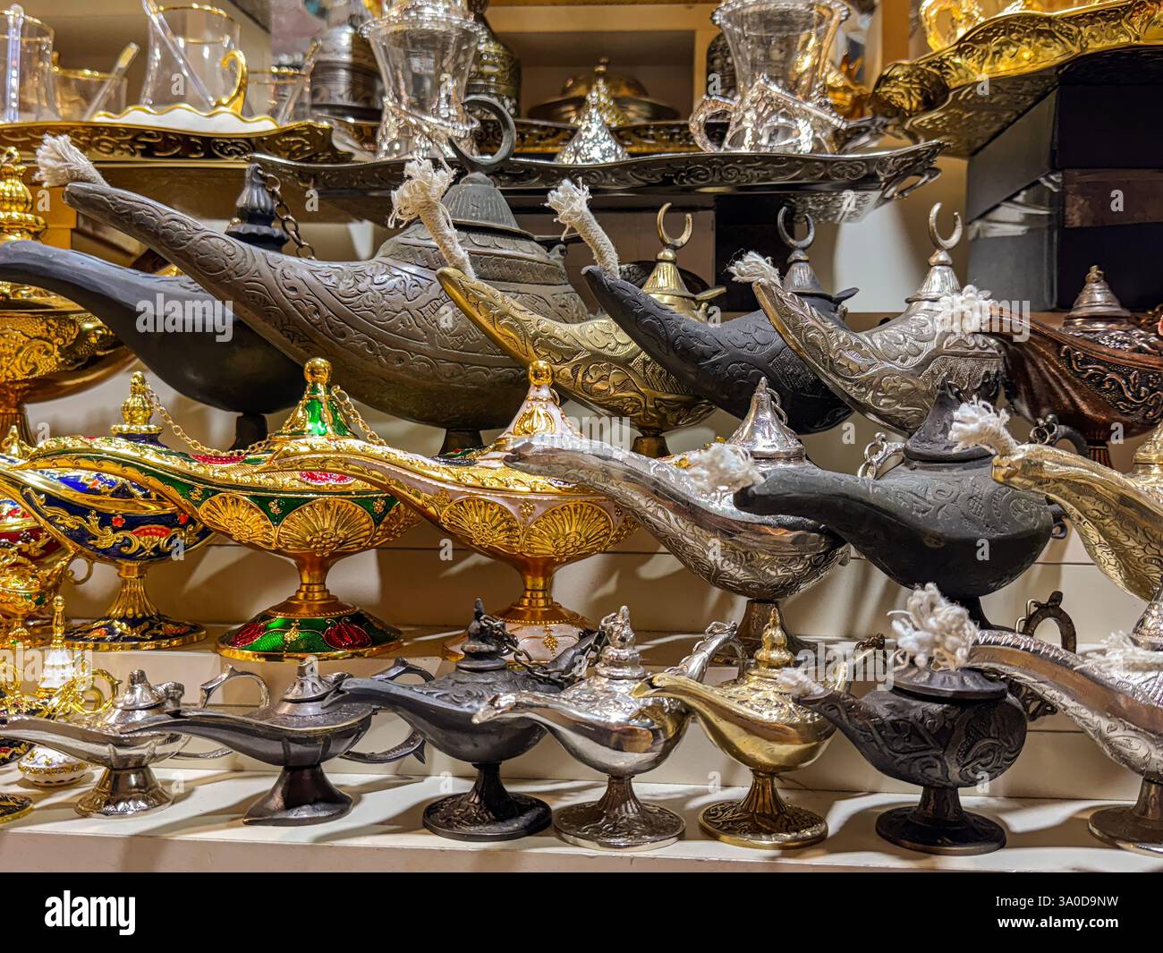 A collection of ornamental Aladdin-inspired magic lamps displayed in a ...
