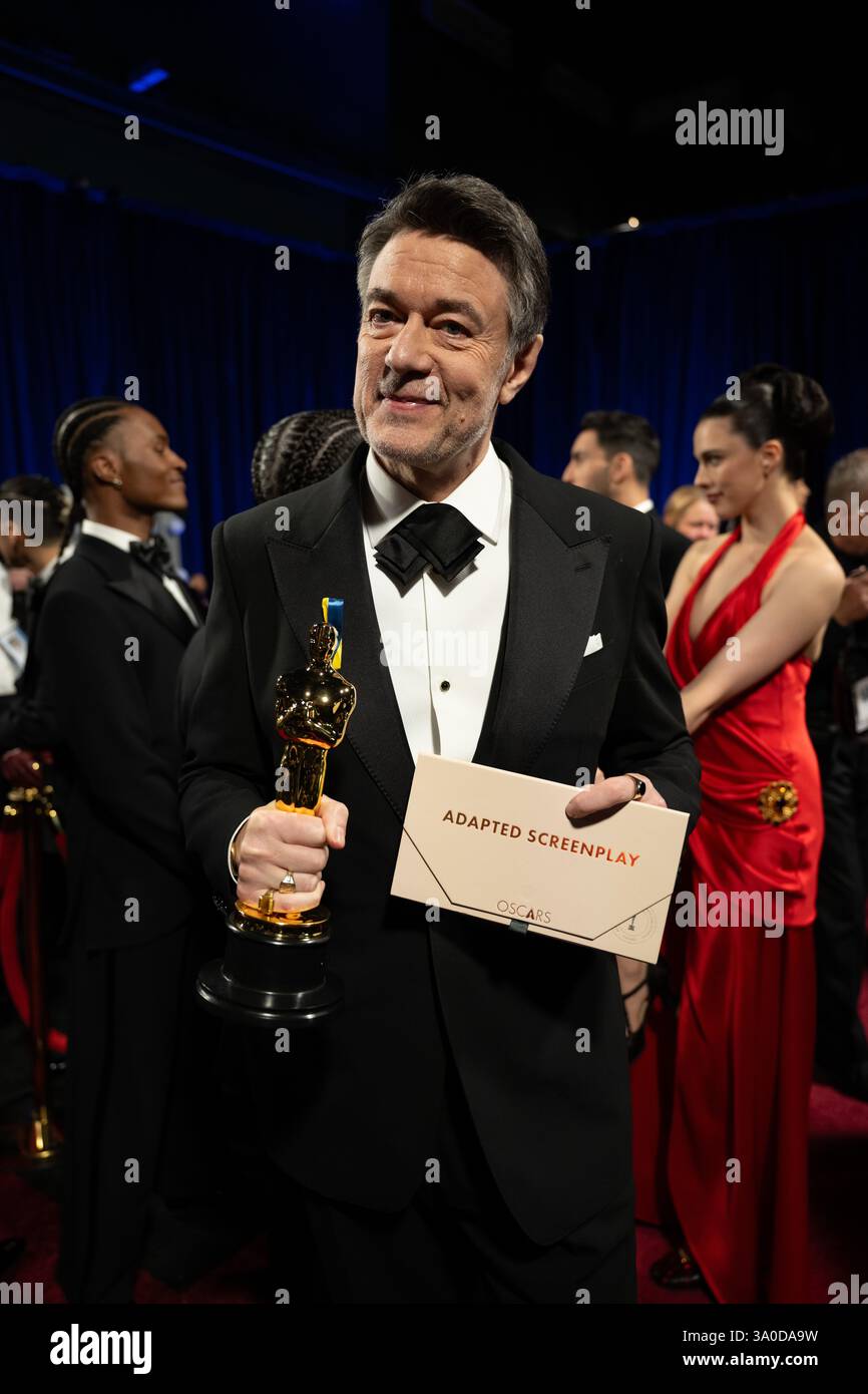 Los Angeles, USA. 02nd Mar, 2025. Peter Straughan poses backstage with ...