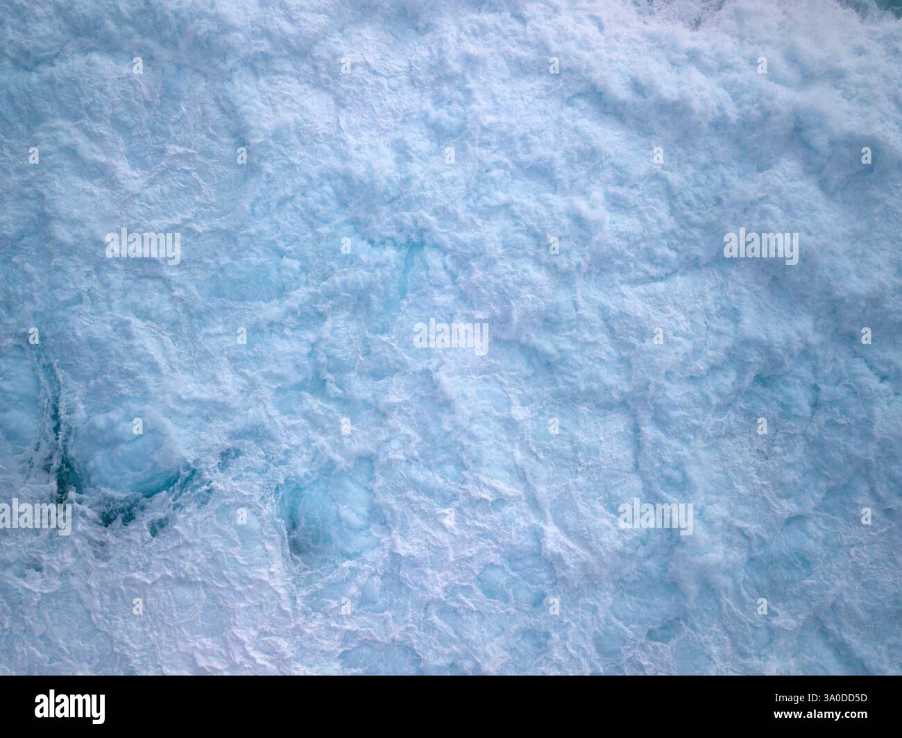 Aerial view looking down on a breaking wave white sea foam creating ...
