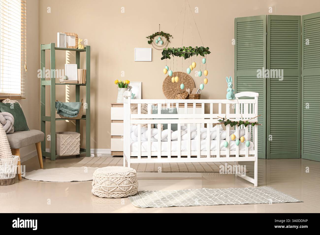 Interior of children's room decorated for Easter with baby crib and ...