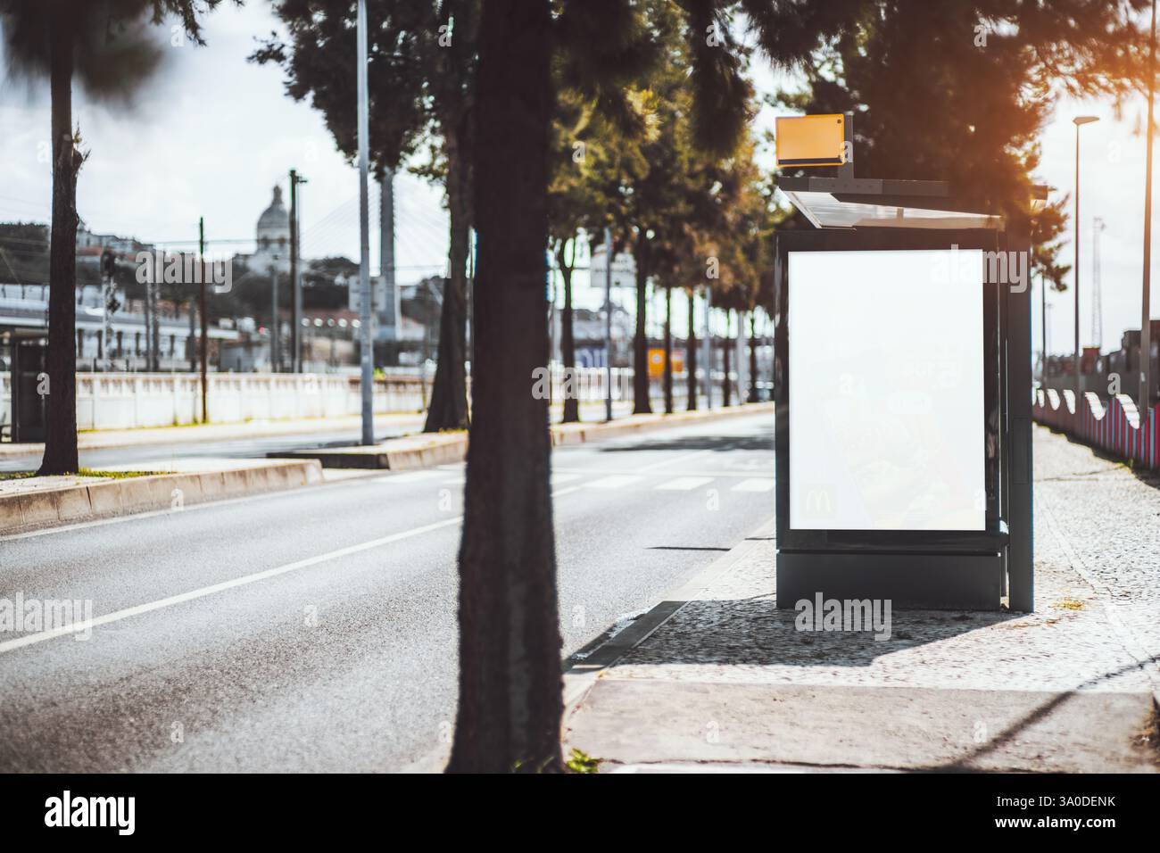 Bus stop with a blank advertising billboard mockup on an empty urban ...