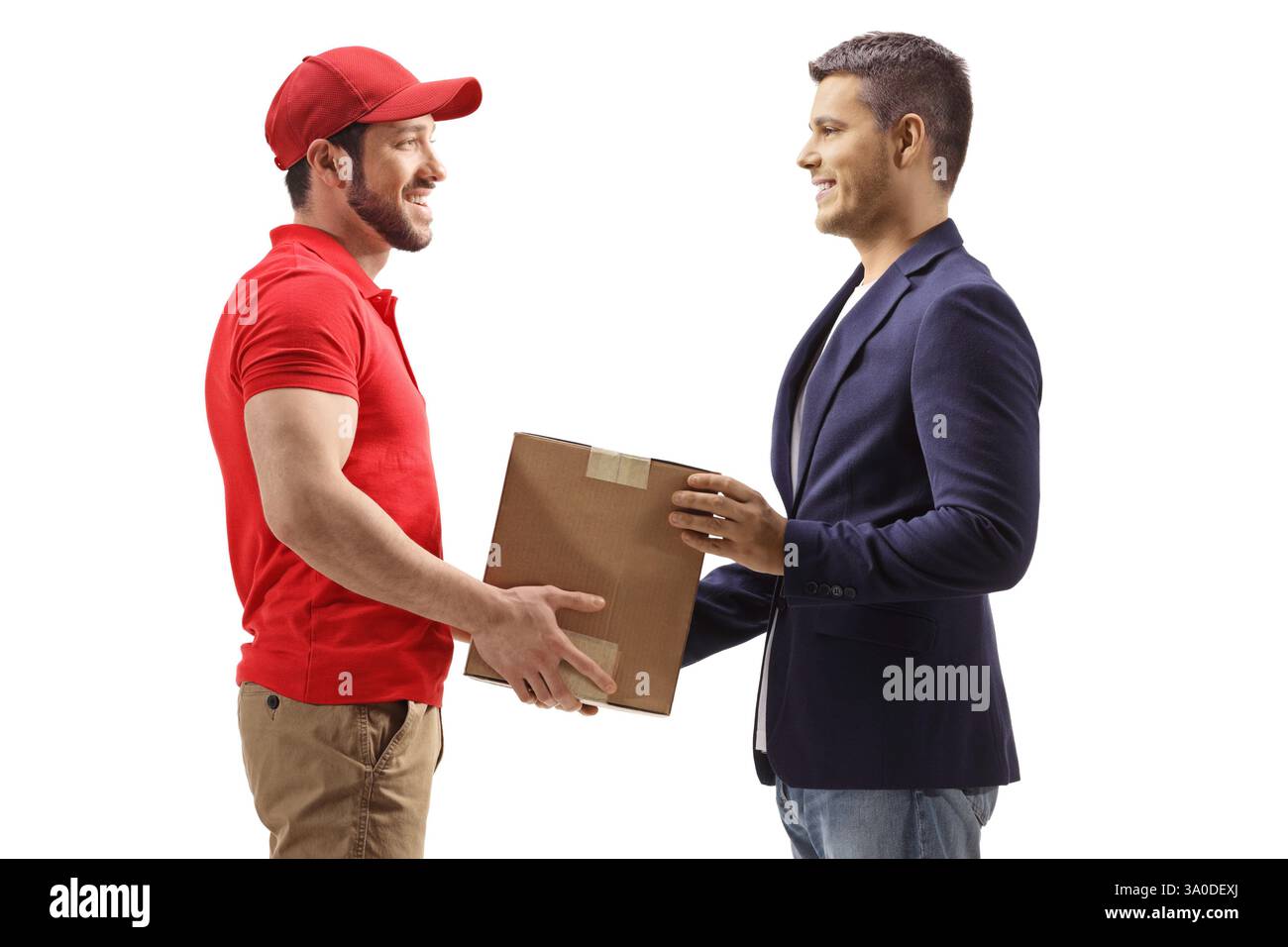 Delivery man handing a cardboard box to a customer isolated on white ...