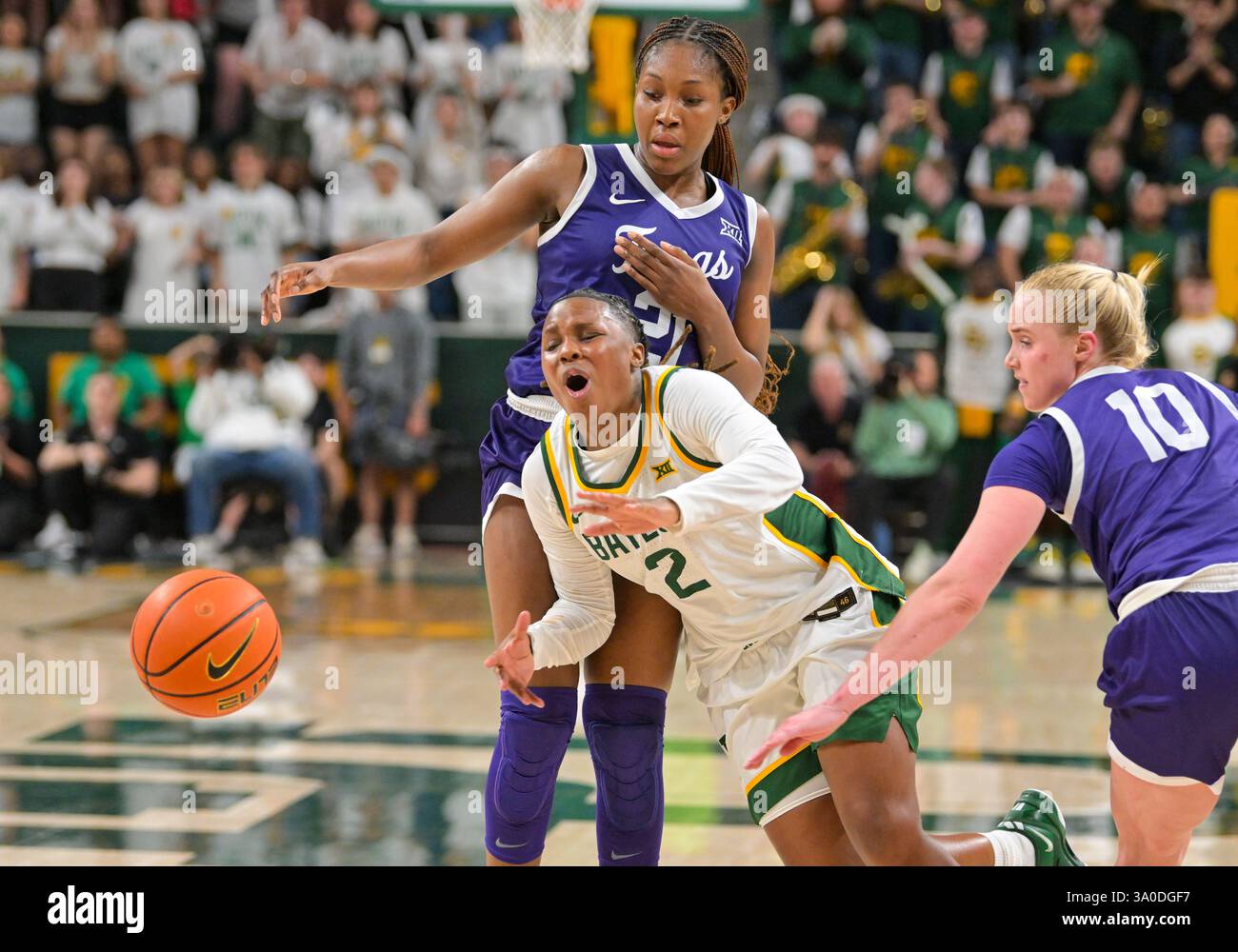 March 2, 2025: TCU Horned Frogs guard Agnes Emma-Nnopu (21) trips up ...