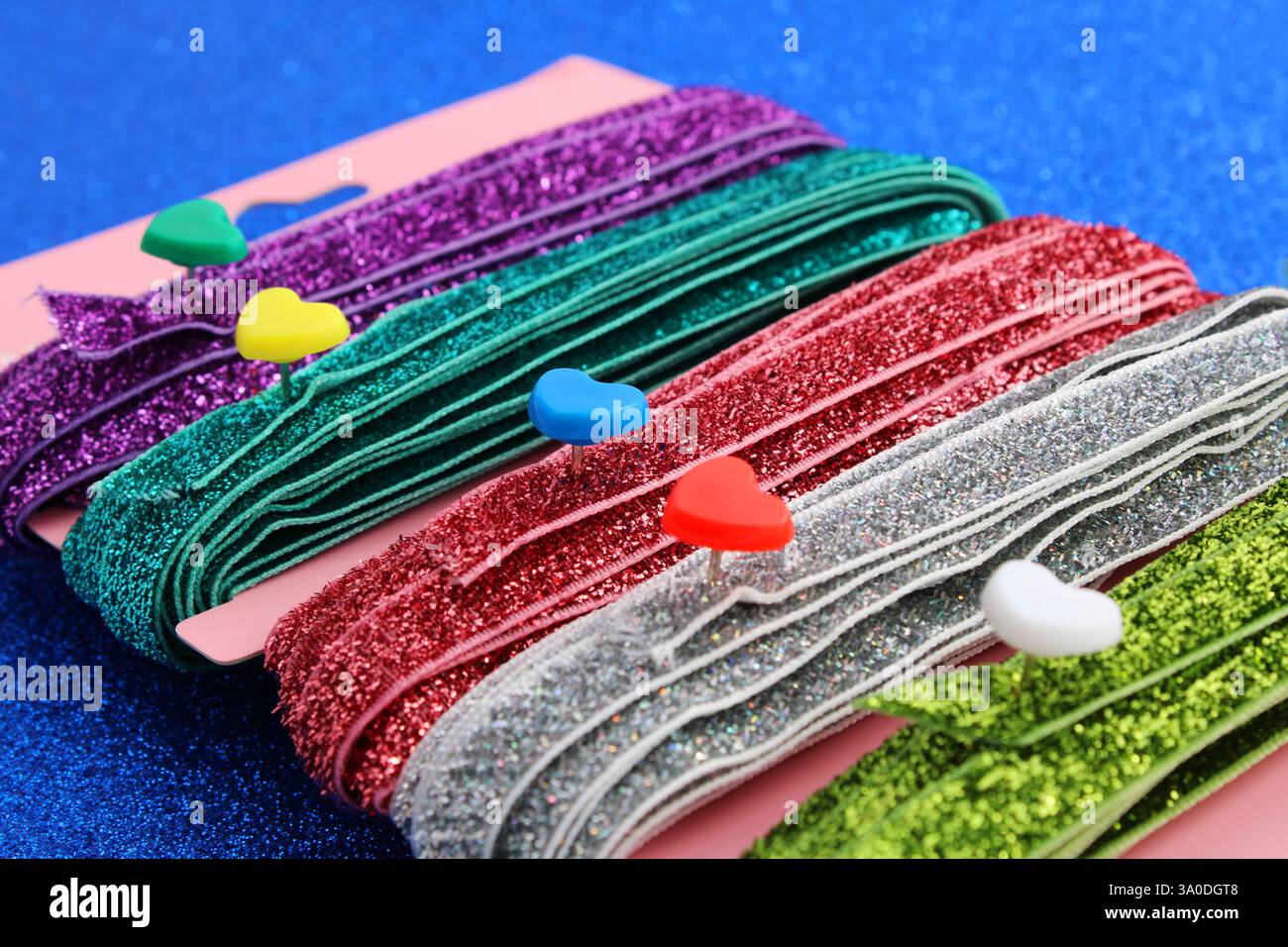 Hearts holding five decorative ribbons Stock Photo - Alamy