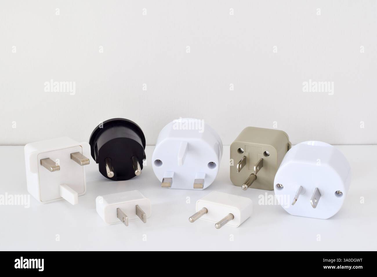 A group of travel power adapters on white background Stock Photo - Alamy