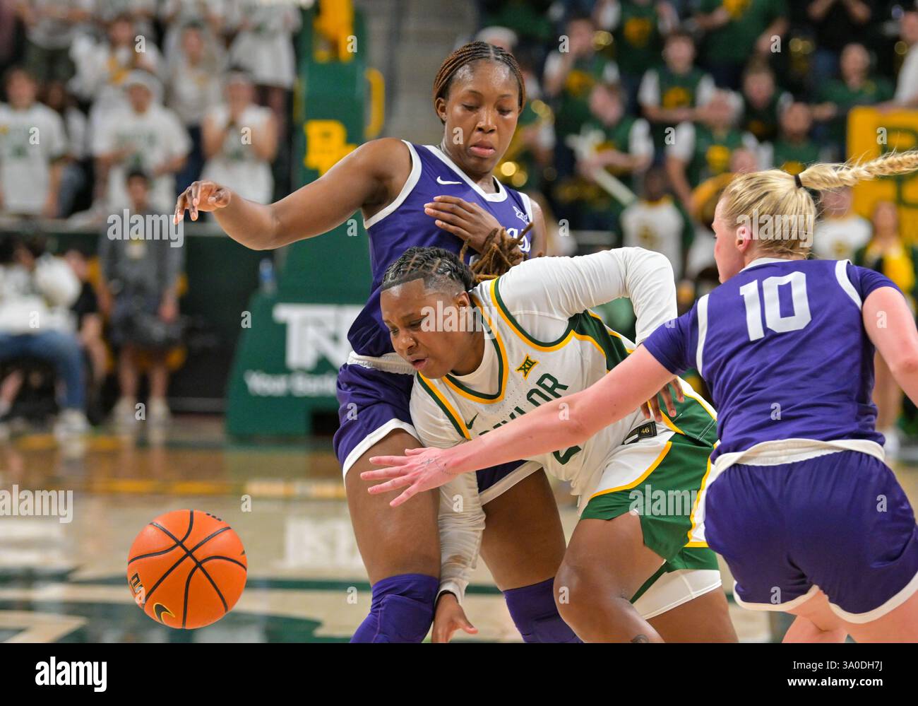 March 2, 2025: TCU Horned Frogs guard Agnes Emma-Nnopu (21) trips up ...