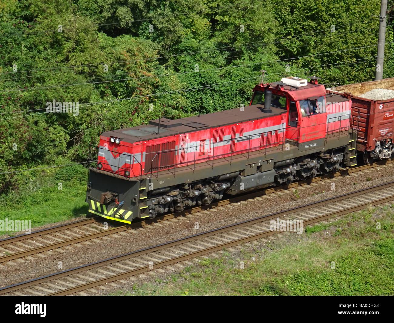 Red Freight Locomotive Moving on the Railway Tracks Stock Photo - Alamy