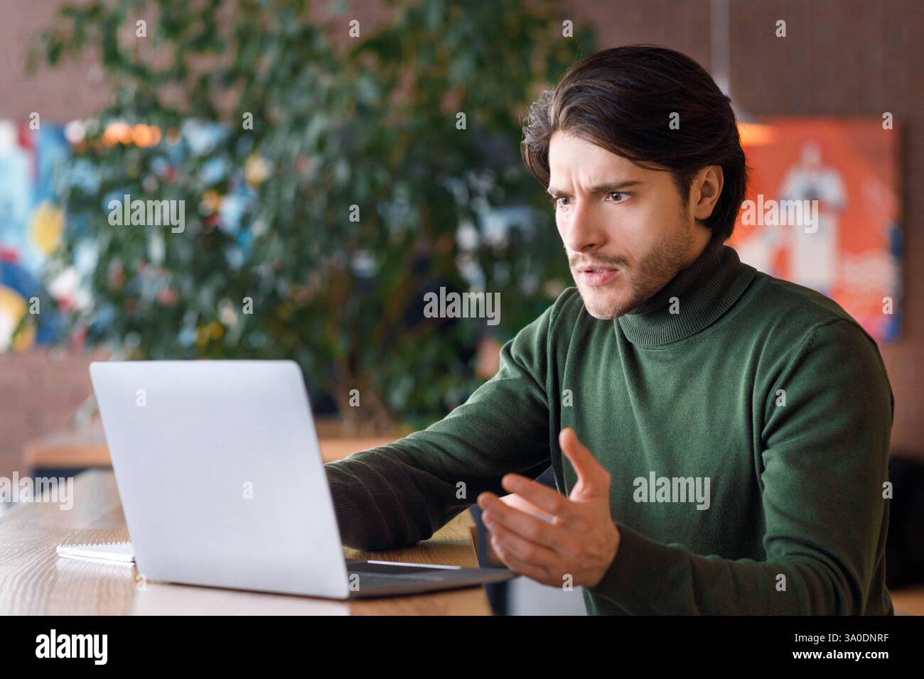 Angry man looking at laptop screen, having troubles with job Stock ...