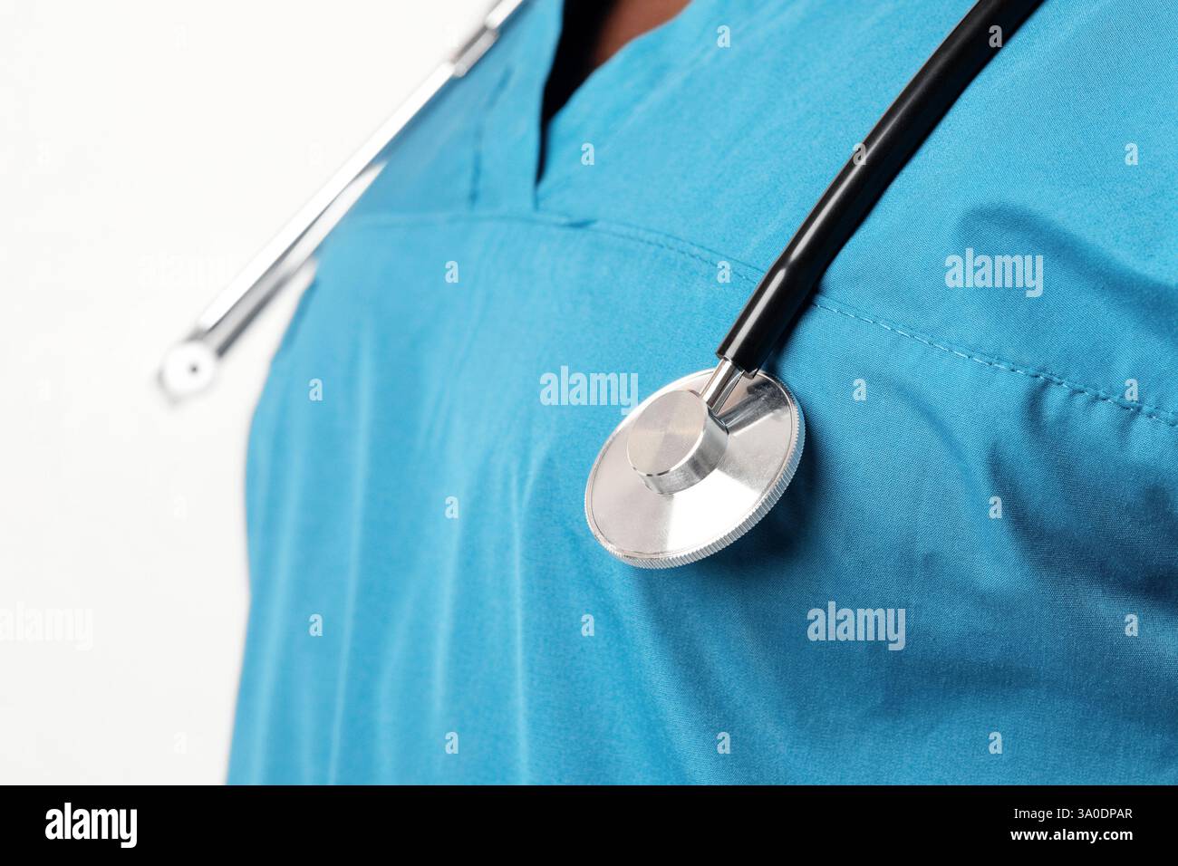 Healthcare professional in scrubs with stethoscope in hospital setting ...