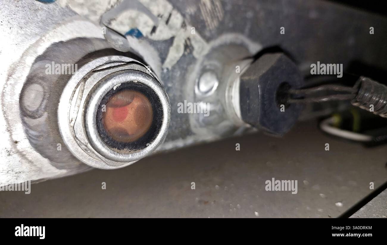 Close examination of an oil sump plug shows intricate details in a ...