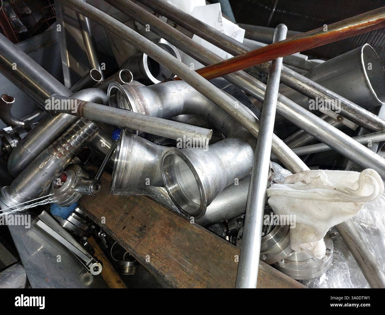 Rusted remnants of stainless steel pipes are scattered across a vibrant ...